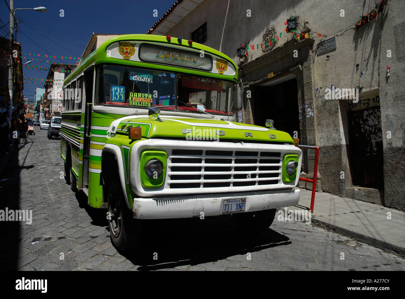 Public bus passing in narrow street of central La Paz, capital of ...