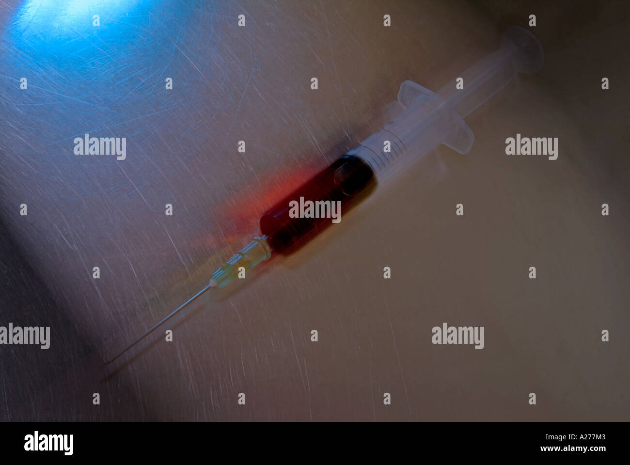syringe filled with blood Stock Photo - Alamy