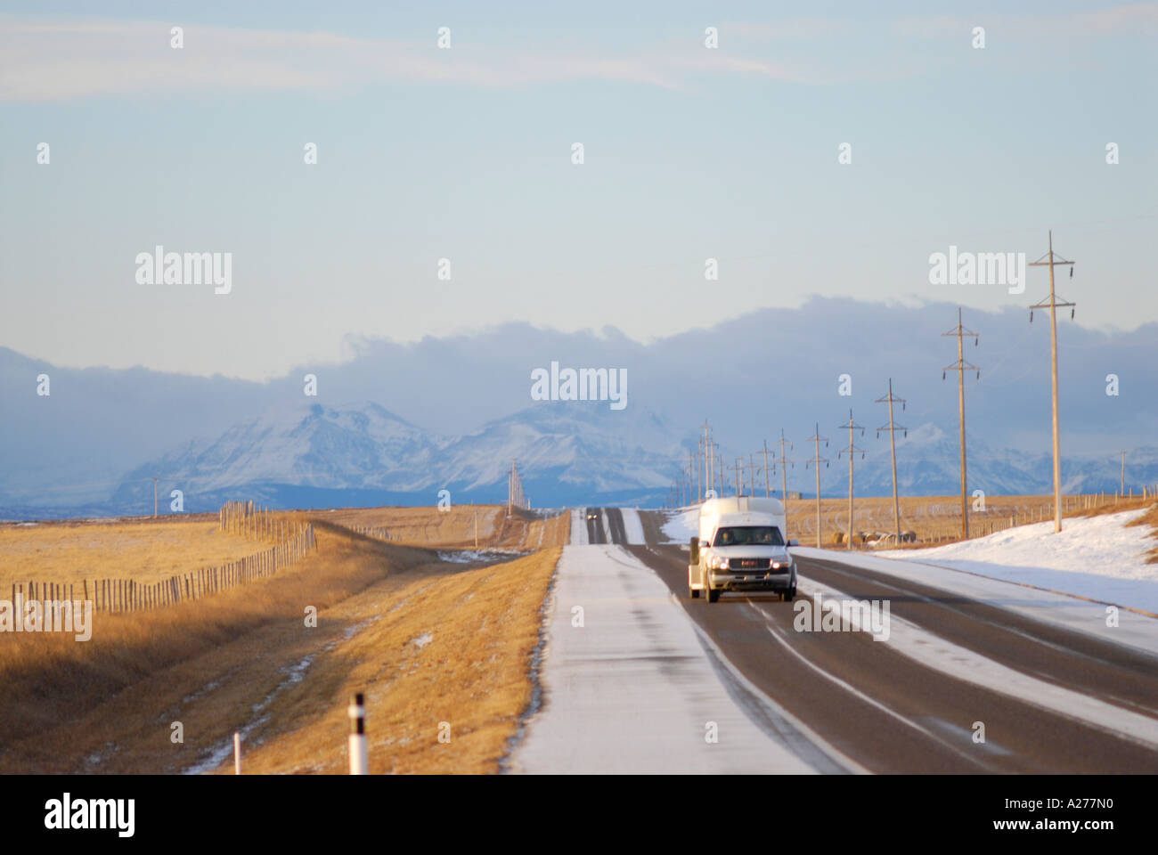 Travelling on prairie highway across southern Alberta Canada with Rocky ...