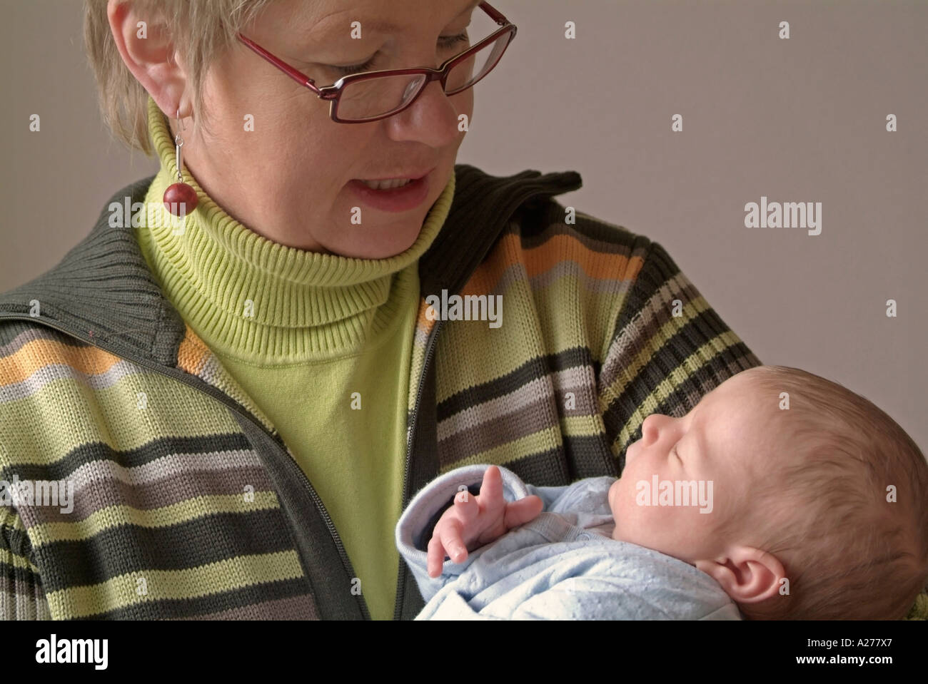 woman 40 to 50 years old holding a new born baby Stock Photo - Alamy