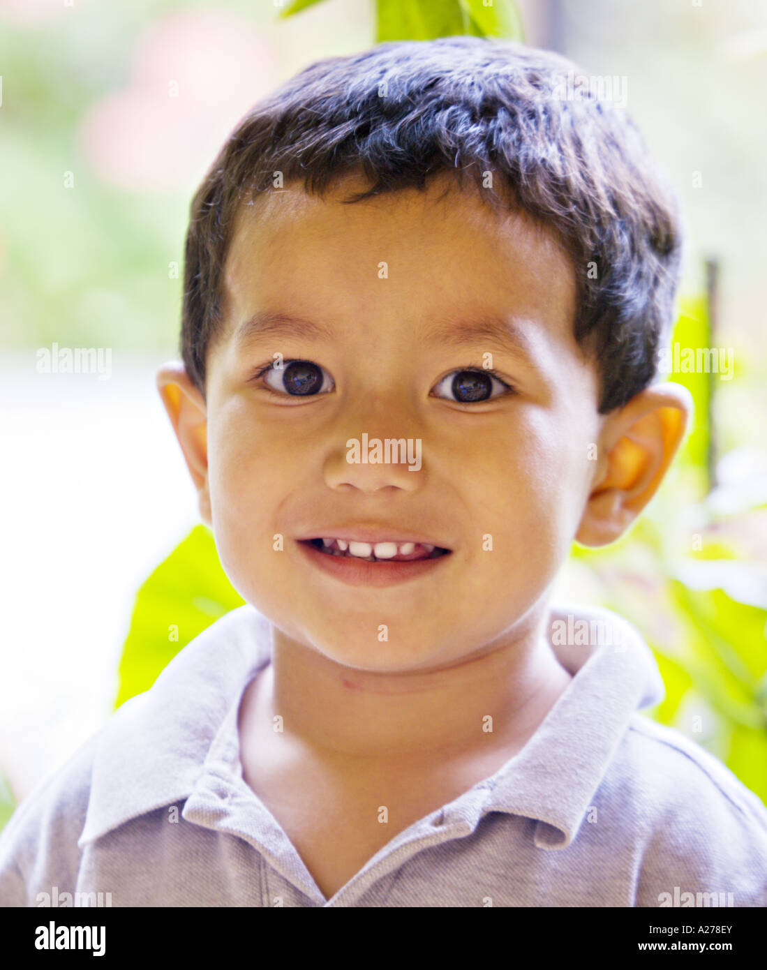 GUATEMALA ANTIGUA Cute Guatemalan three year old boy smiles for the ...