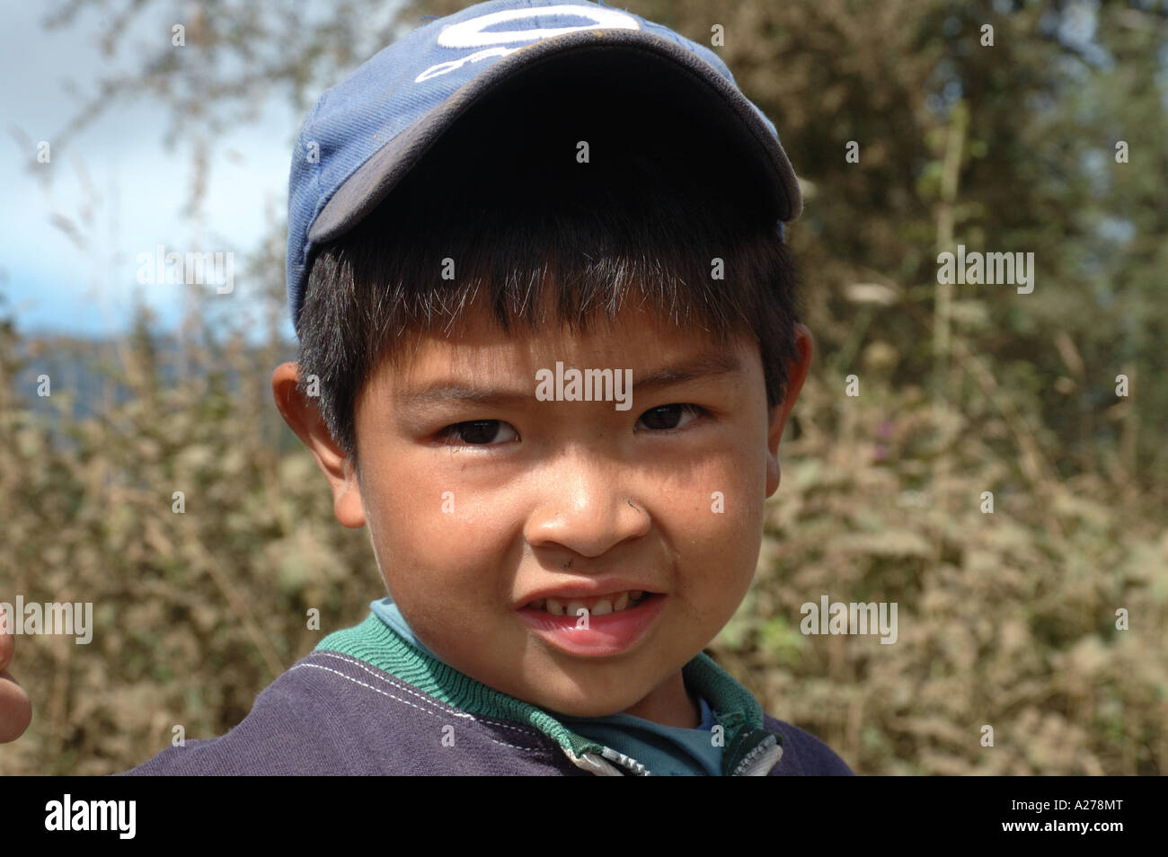 Portrait friendly boy with a cap Chile Stock Photo - Alamy