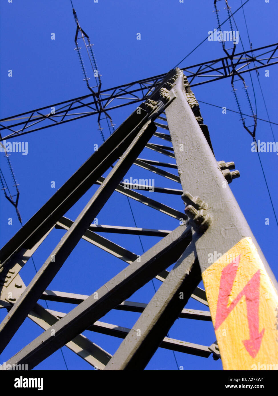 power pylon with warning sign Stock Photo - Alamy