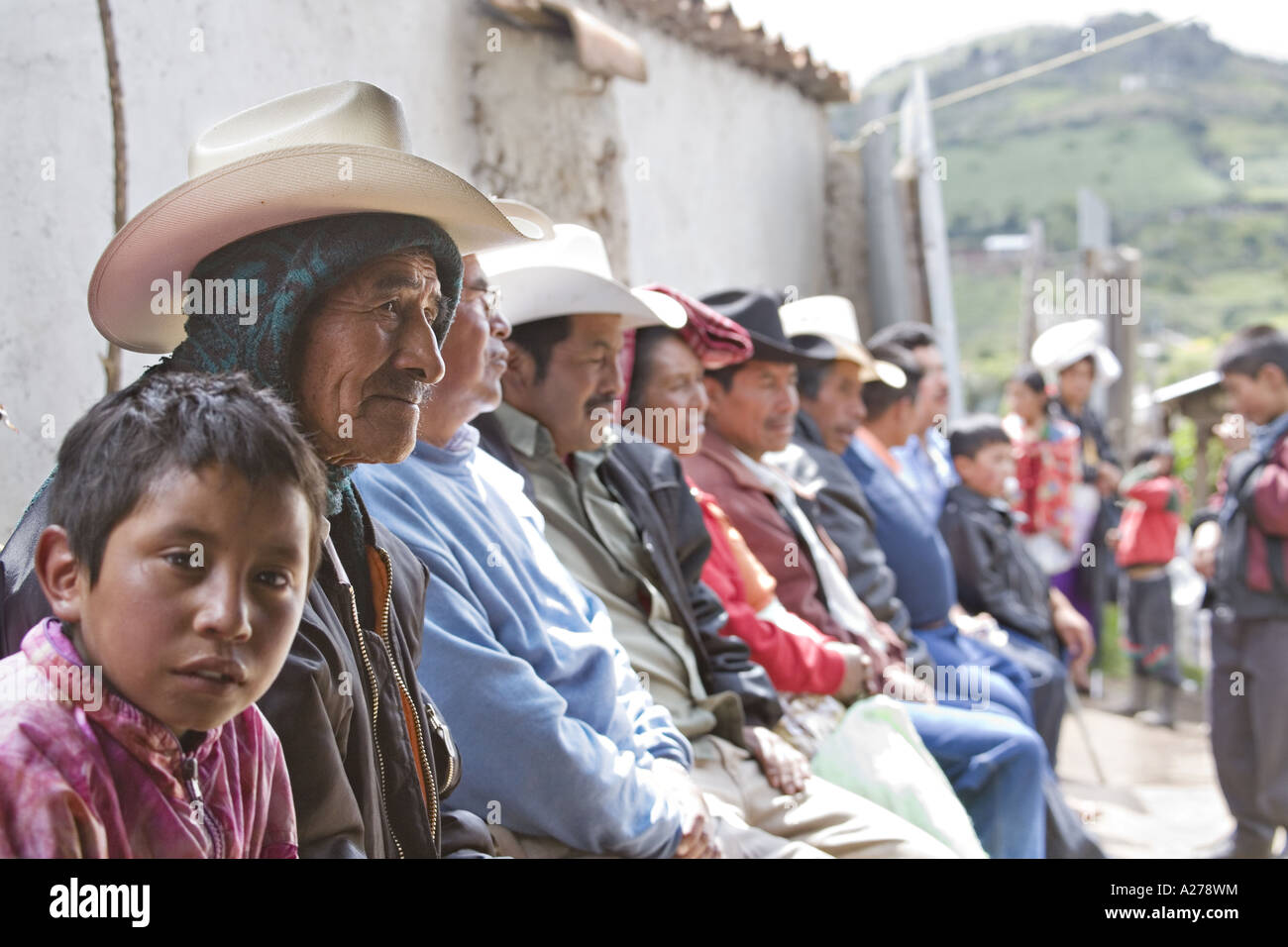 GUATEMALA CAPELLANIA Indigenous Maya Quiche men in cowboy hats wait to ...