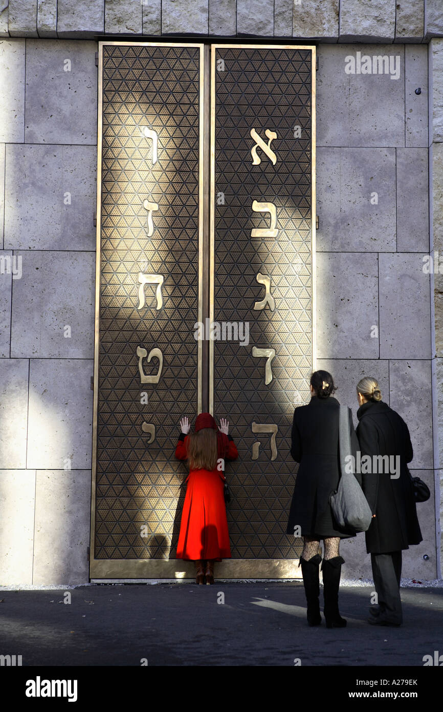 Woman in a red coat prays, Main Synagogue, Munich, Bavaria, Germany ...