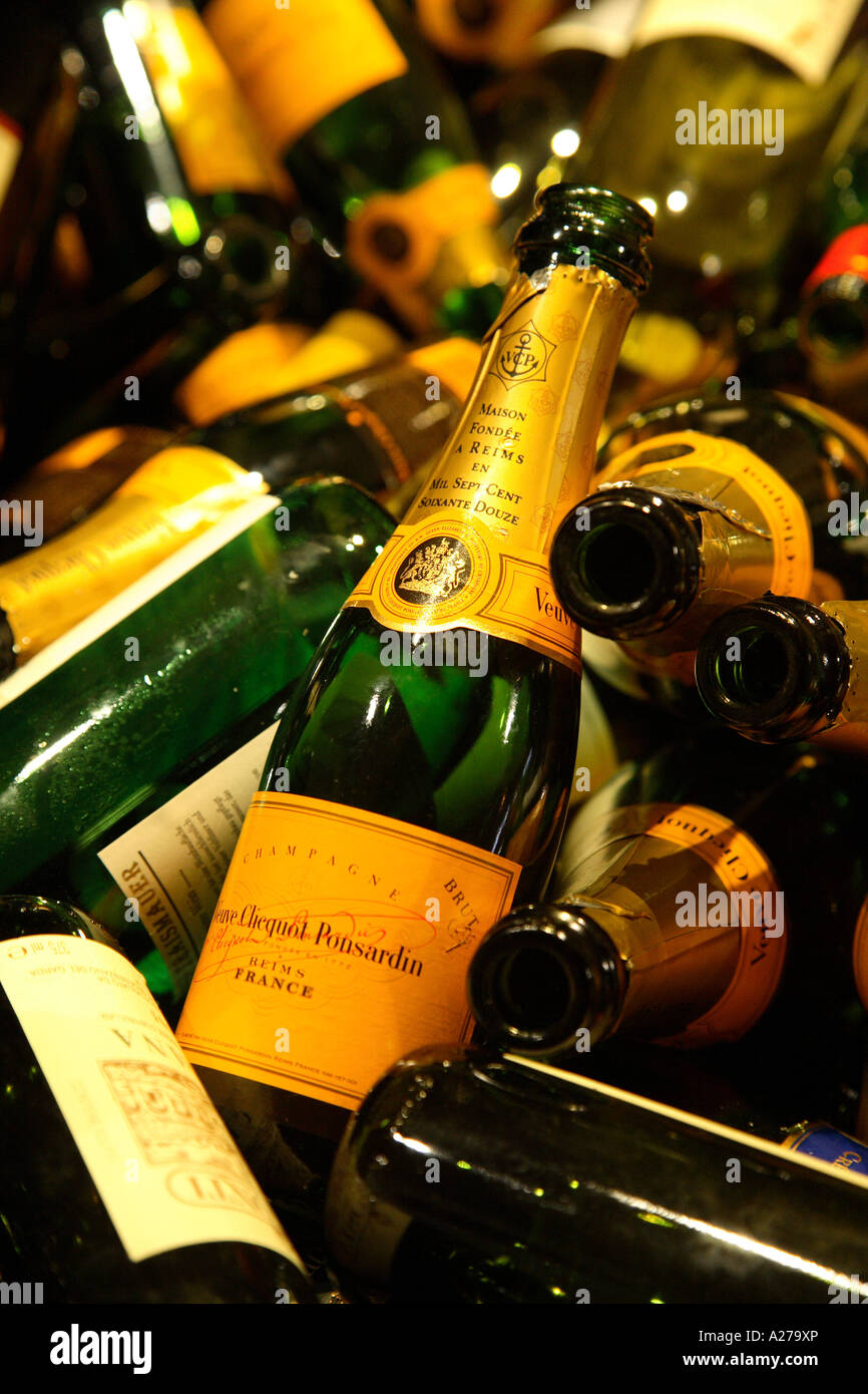 Empty bottle of champagne in the garbage Stock Photo - Alamy