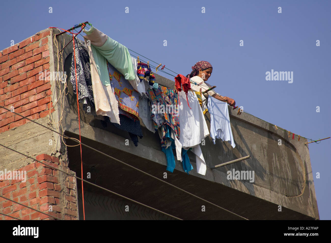 Egyptian Woman hanging out Washing Outside Her House in Cairo Stock ...