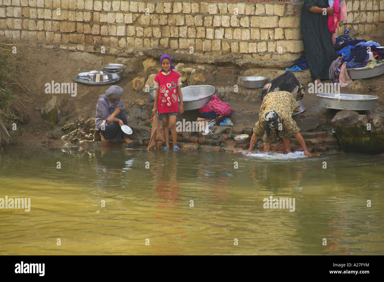 Girl washing clothes in river hi-res stock photography and images - Alamy