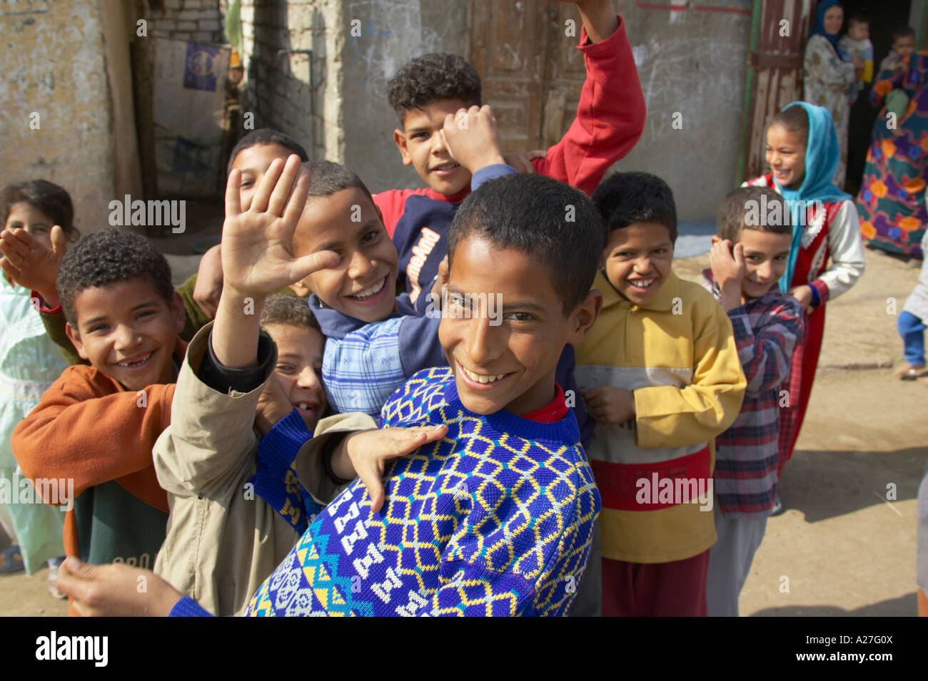 Group Of Egyptian Children Outdoors Smiling And Waving Into Camera ...