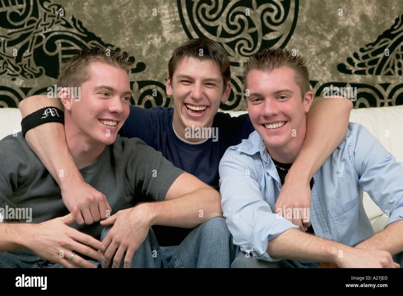 Three friends including identical twins enjoying togetherness Stock ...