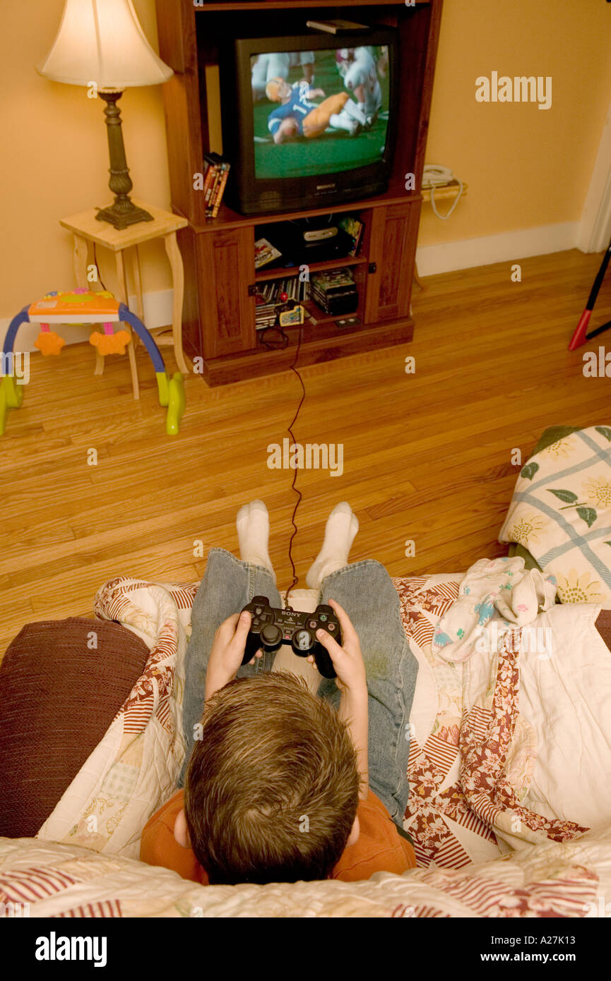 Boy playing Sony Playstation Stock Photo - Alamy