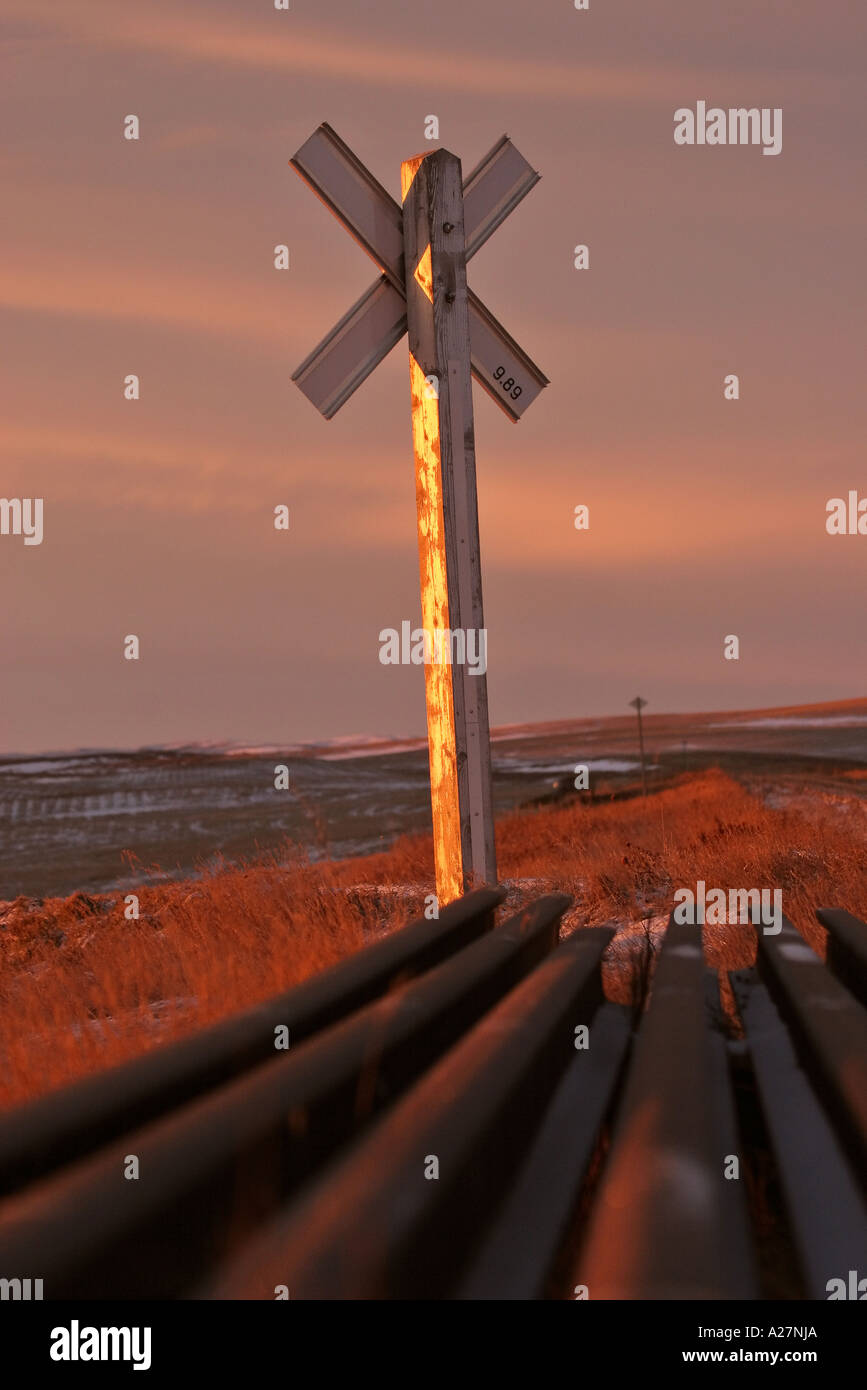 Railroad tracks by a Railroad Crossing sign in scenic Saskatchewan ...