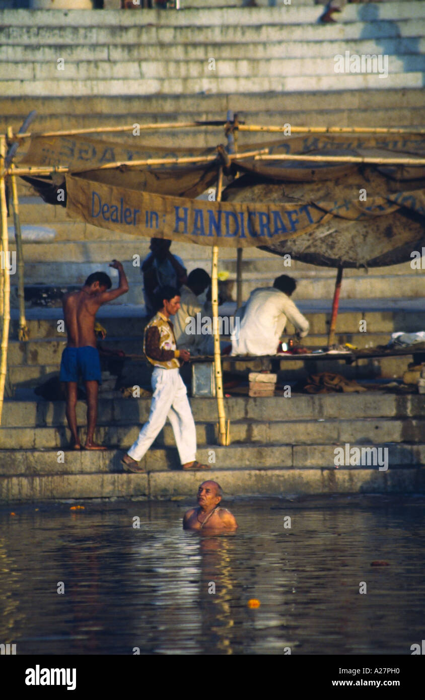 Man washing and bathing in the sacred river Ganges, Benares, India ...