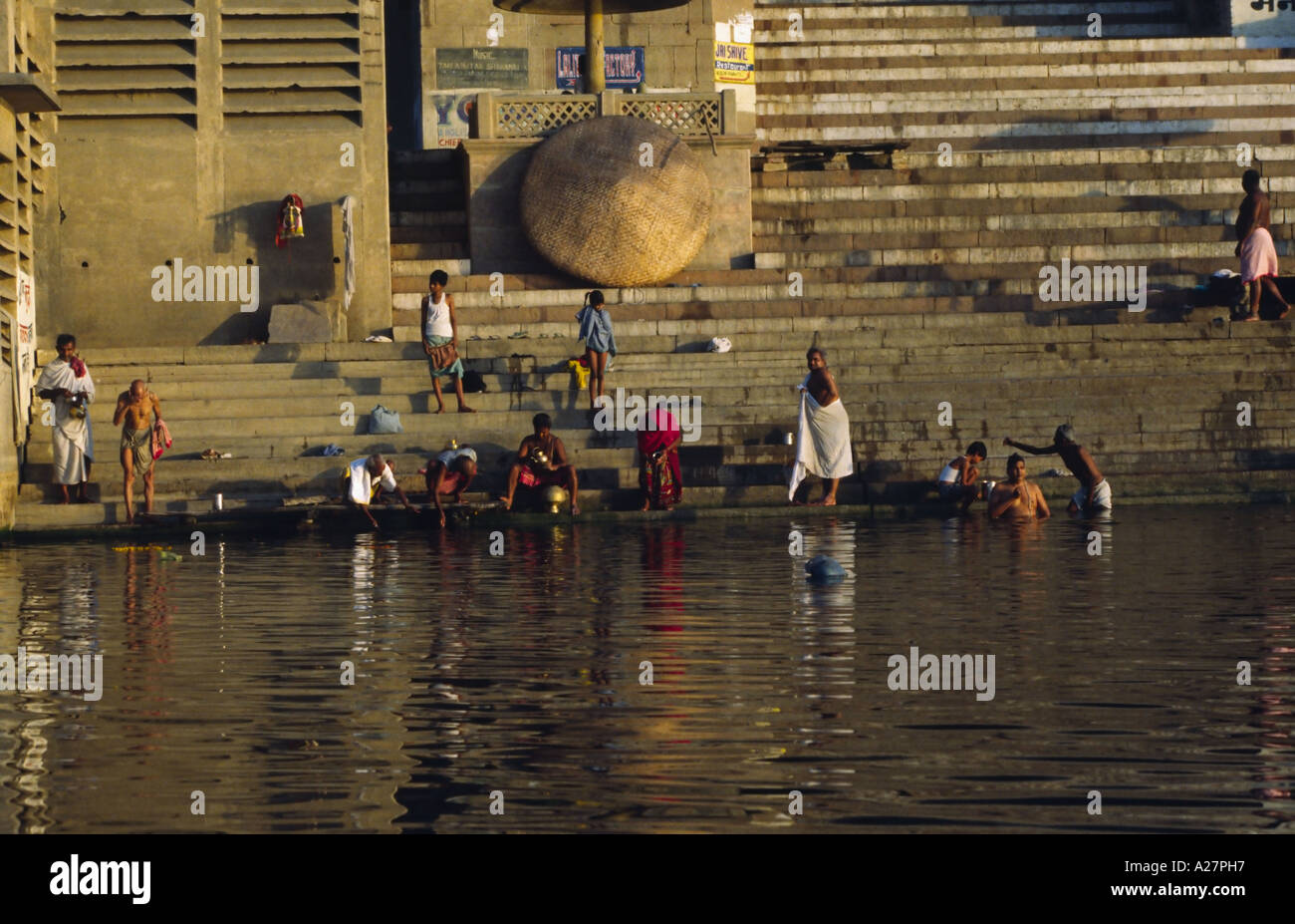 Men washing and bathing in the sacred river Ganges, Benares, India ...