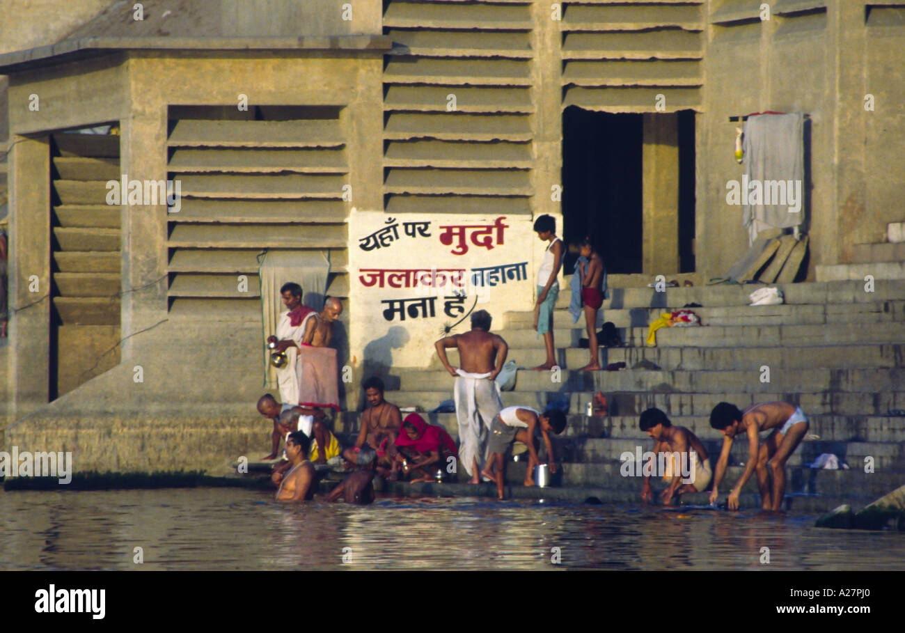 Men washing and bathing in the sacred river Ganges, Benares, India ...