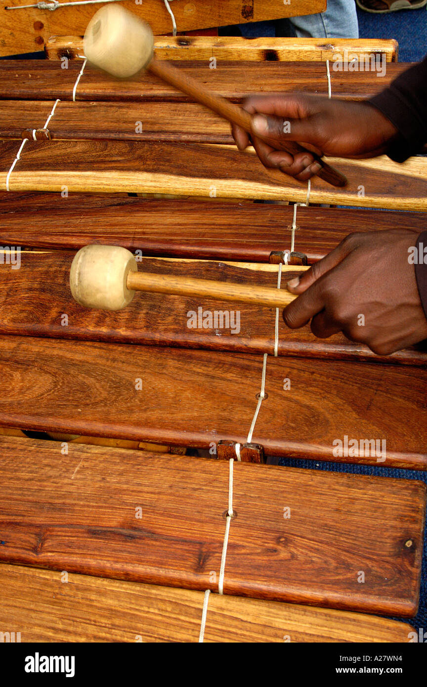 Black African hands playing a xylophone Stock Photo - Alamy