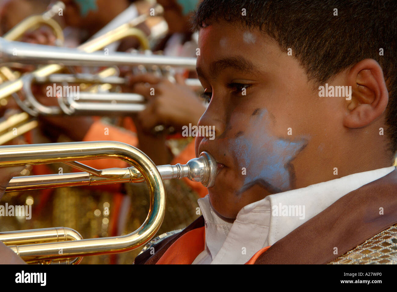 Young coloured boy playing trumpet Stock Photo - Alamy