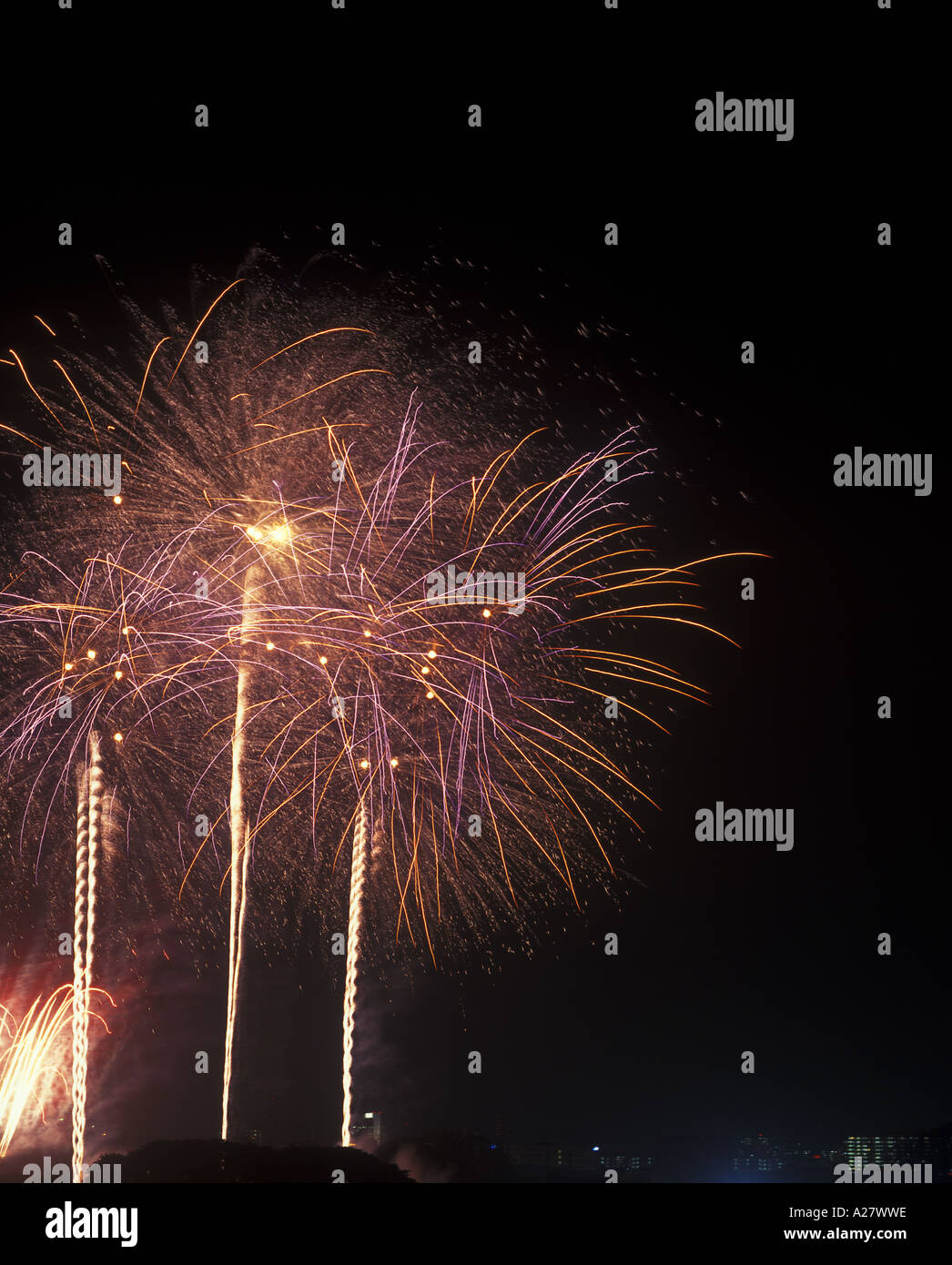 Fireworks explode over the National Stadium Singapore in celebration of ...