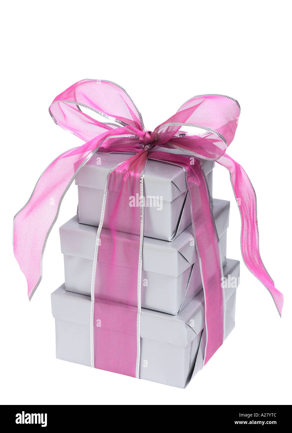Stack of silver wrapped presents with a pink bow Stock Photo - Alamy