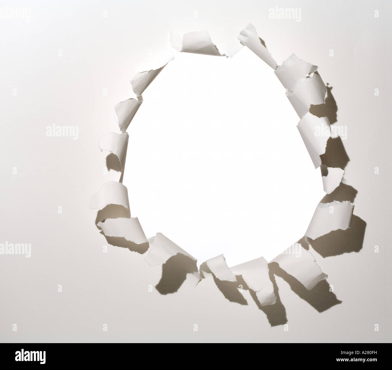 hole in paper Stock Photo - Alamy