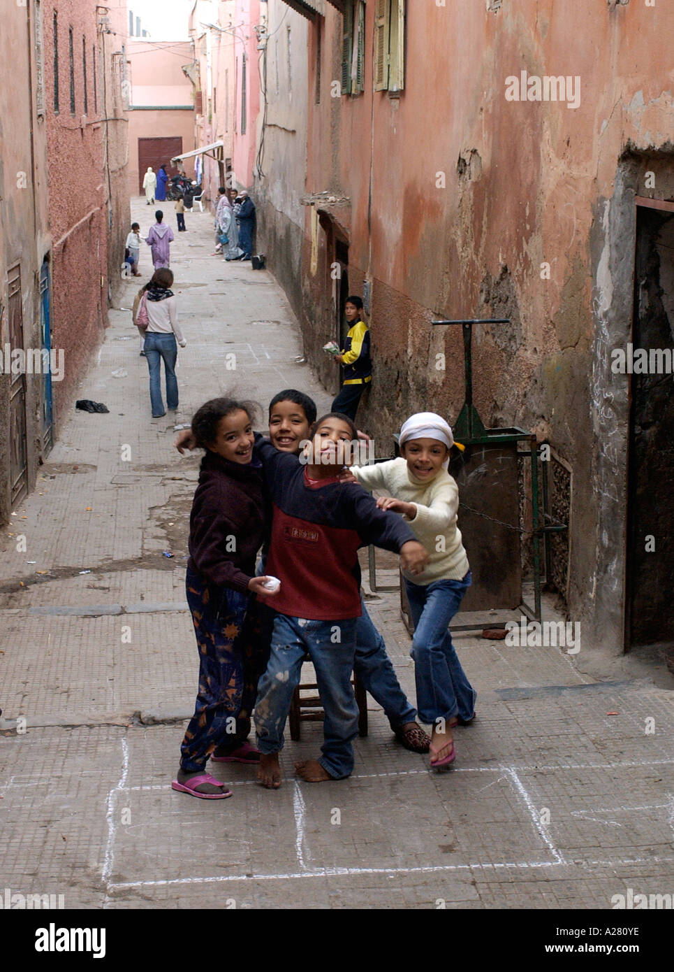 Children play on a back street of Marrakech, Morocco Stock Photo - Alamy