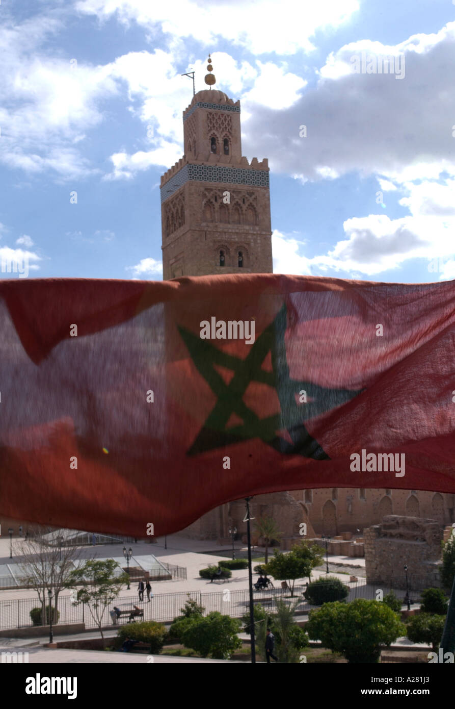 The Moroccan flag waves infront of the Koutoubia Mosque in Marrakech ...