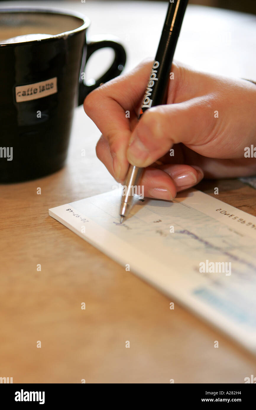 Writing a cheque hi-res stock photography and images - Alamy