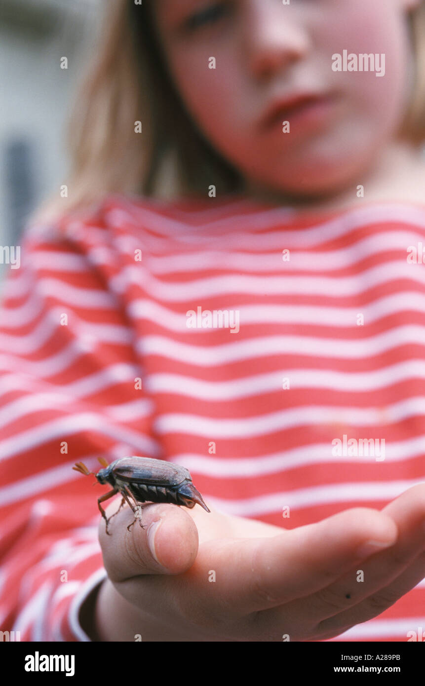 CLOSE-UP OF GIRL HOLDING MAY-BUG PORTRAIT PEOPLE FEMALE CHILD MODEL ...