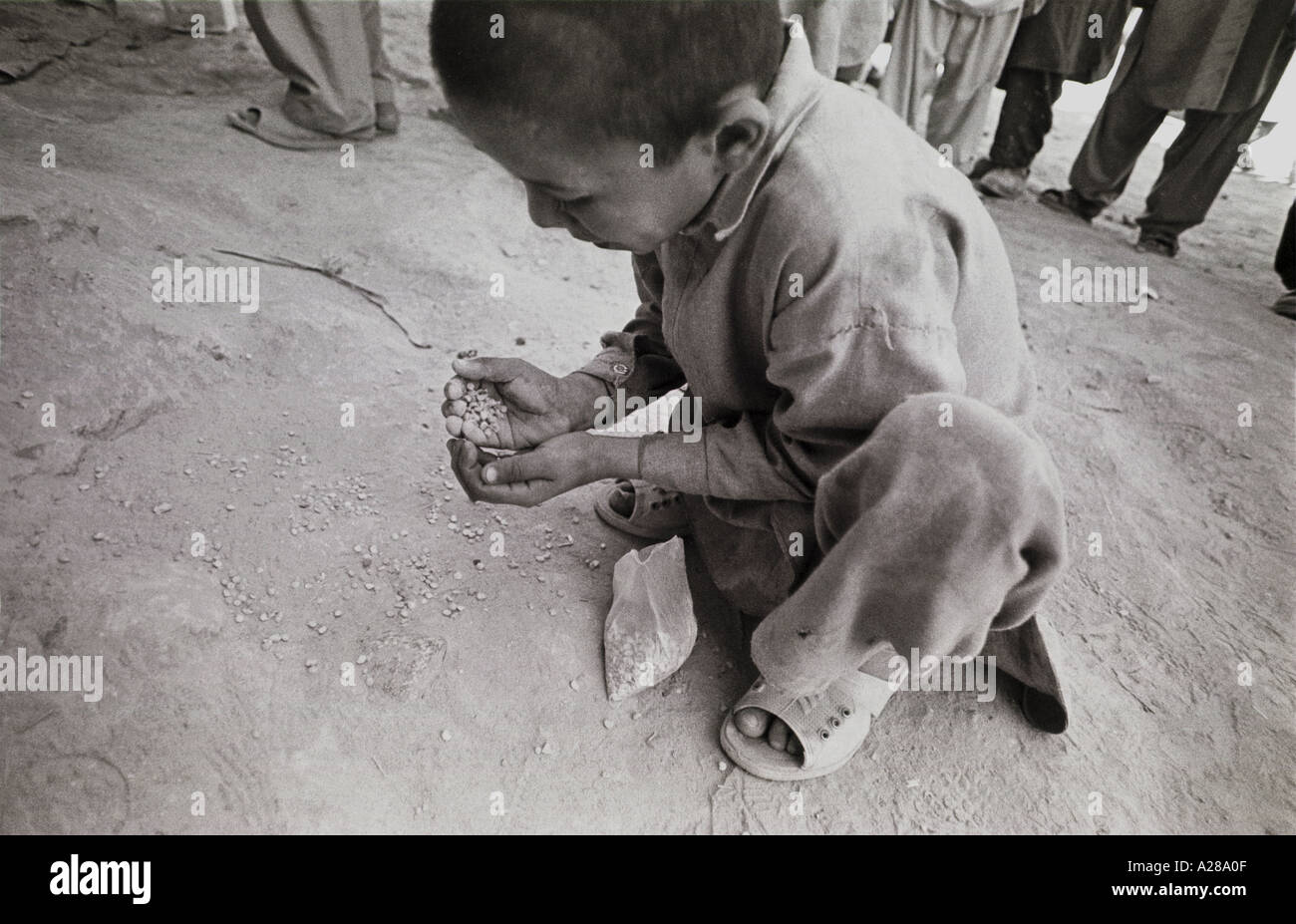 Refugee child hunger poverty famished hi-res stock photography and ...