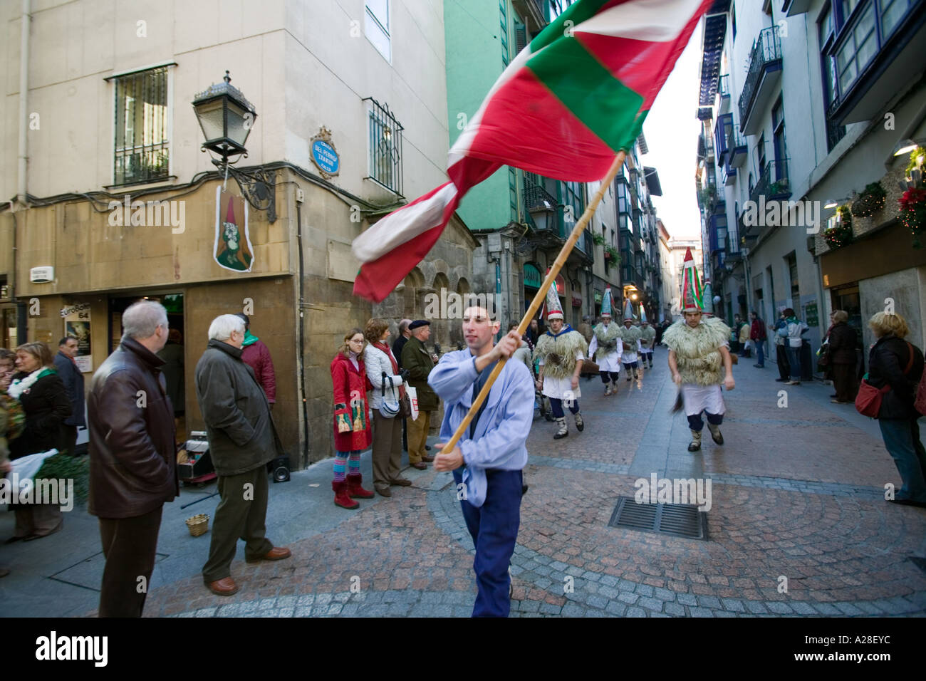 Basque men perform the Joaldunak folk dance in traditional costumes ...