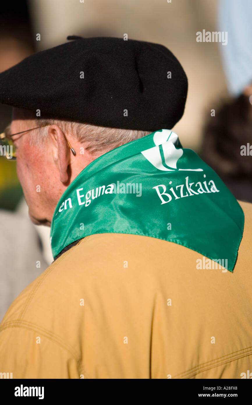 Rear view of an elderly man wearing a green Bizkaia neck scarf and ...
