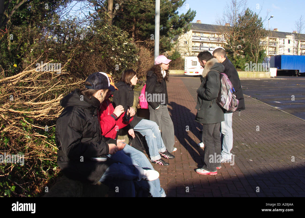 Crowd of teenagers hanging around Stock Photo - Alamy