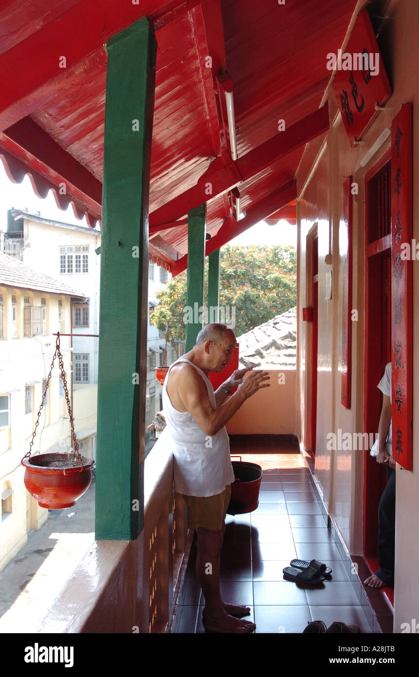 man praying in Chinese temple in Mazgaon Mumbai Maharashtra India Stock ...