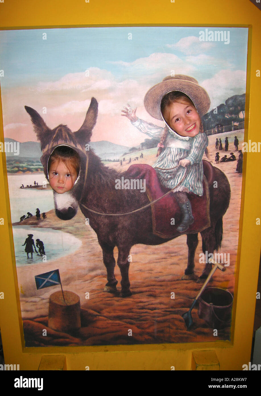 Sisters posing at fun photo opportunity stand Stock Photo - Alamy