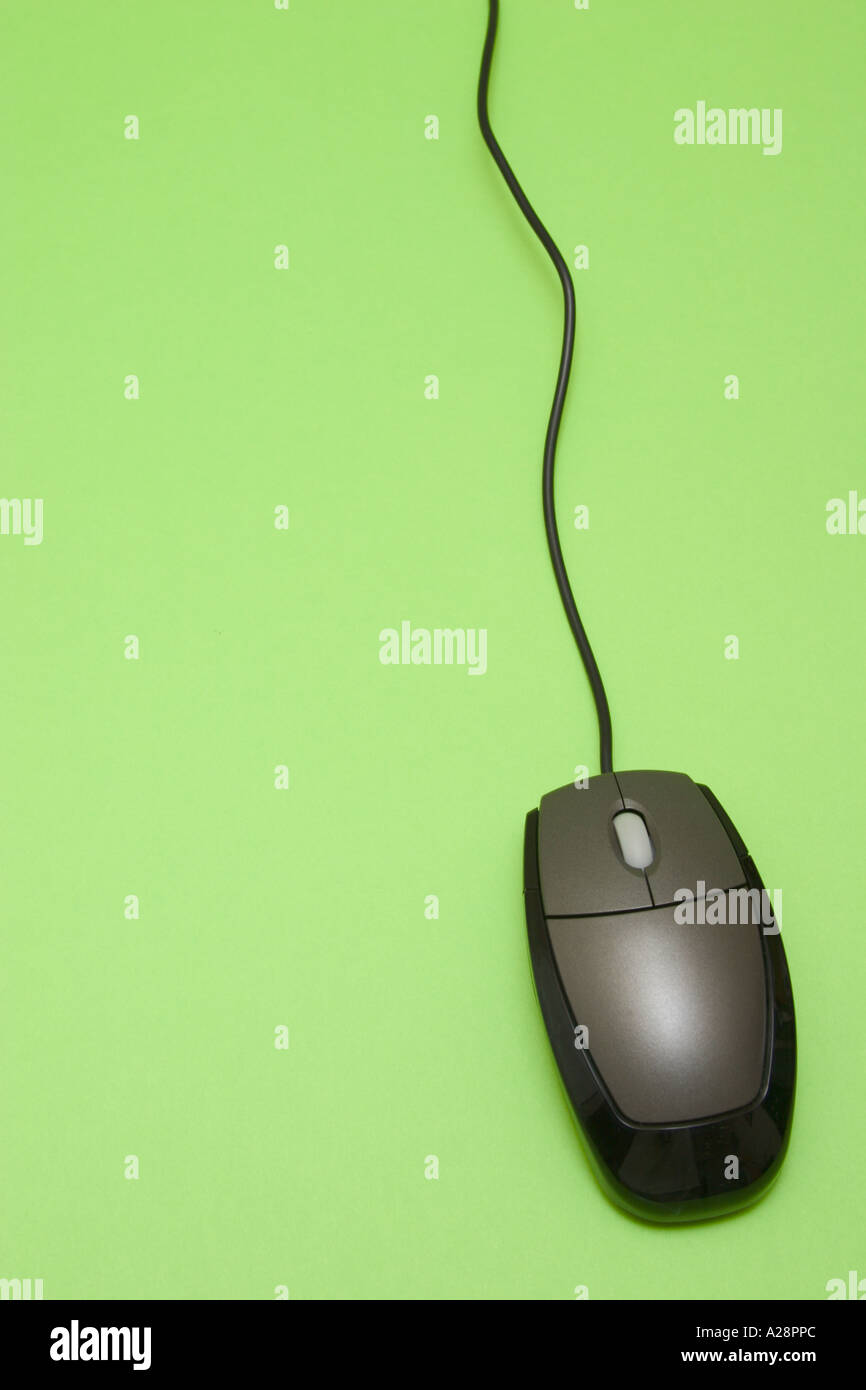 black mouse isolated on green background Stock Photo - Alamy