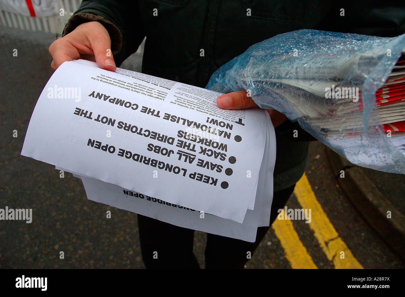 handing out leaflets Stock Photo - Alamy