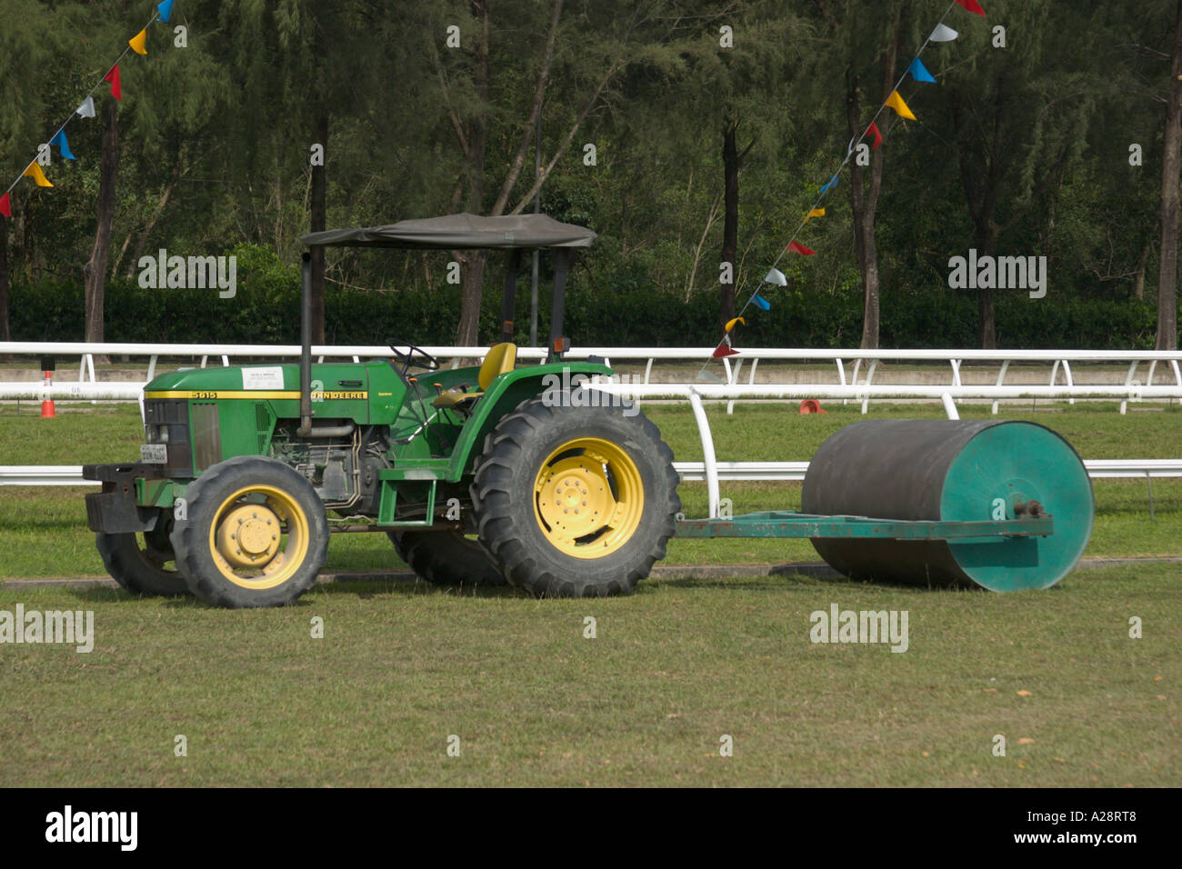 tractor and lawn roller at equestrian field Stock Photo - Alamy