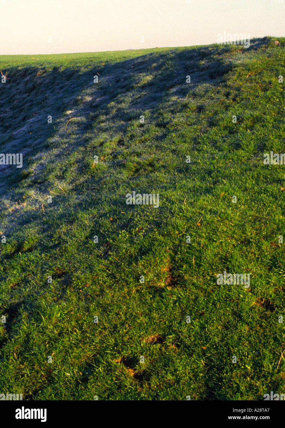 Aspect shown by frost on north facing slope Stock Photo - Alamy