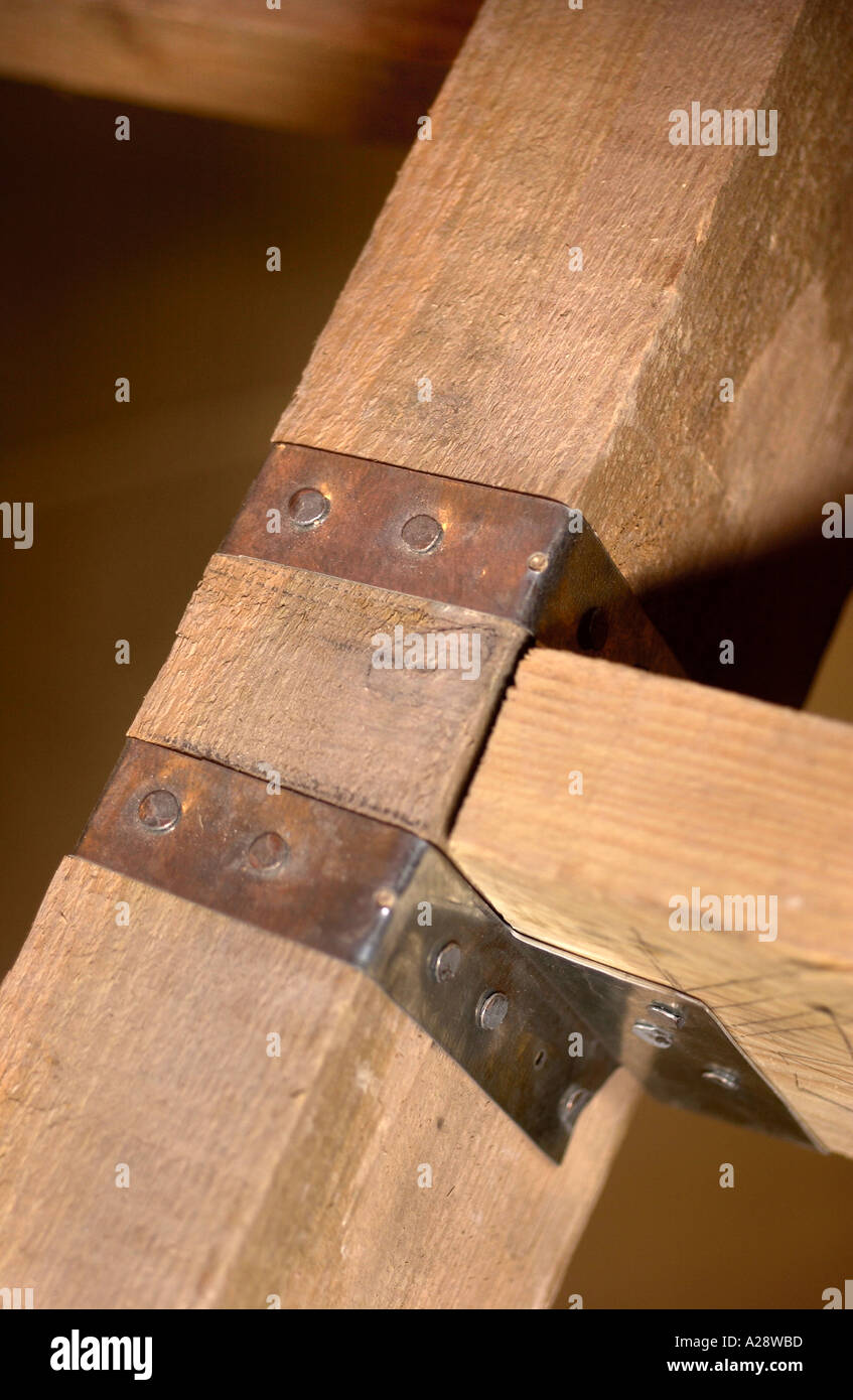 BUILDING AN EXTENSION TWO JOISTS SECURED WITH A STEEL JOIST HANGER ...