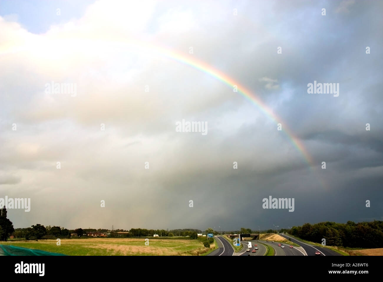 Rainbow over traffic Stock Photo - Alamy