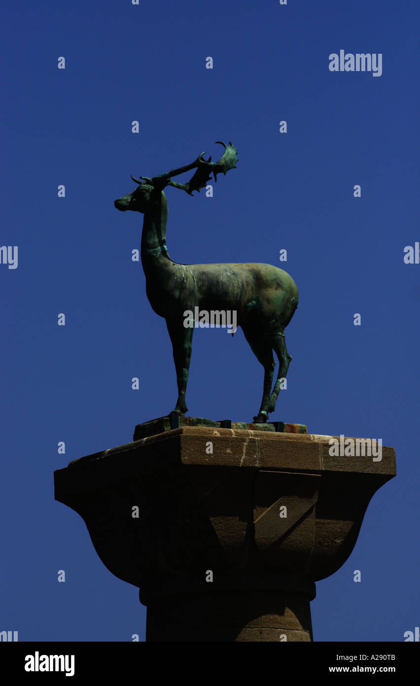 Bronze statue of stag at the entrance of Mandraki harbor RHODES Greece ...