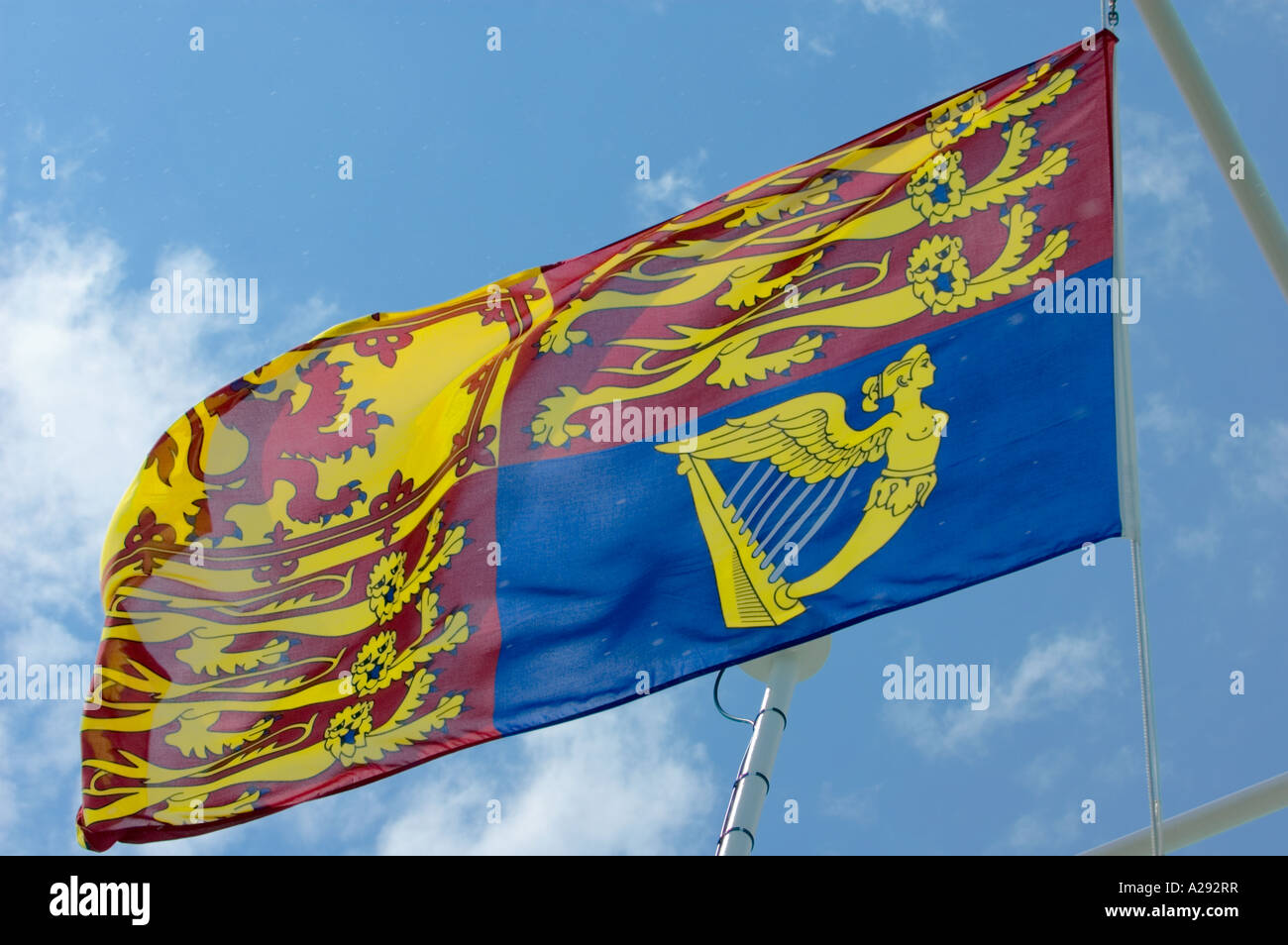 Royal standard Flying against a blue sky Stock Photo - Alamy