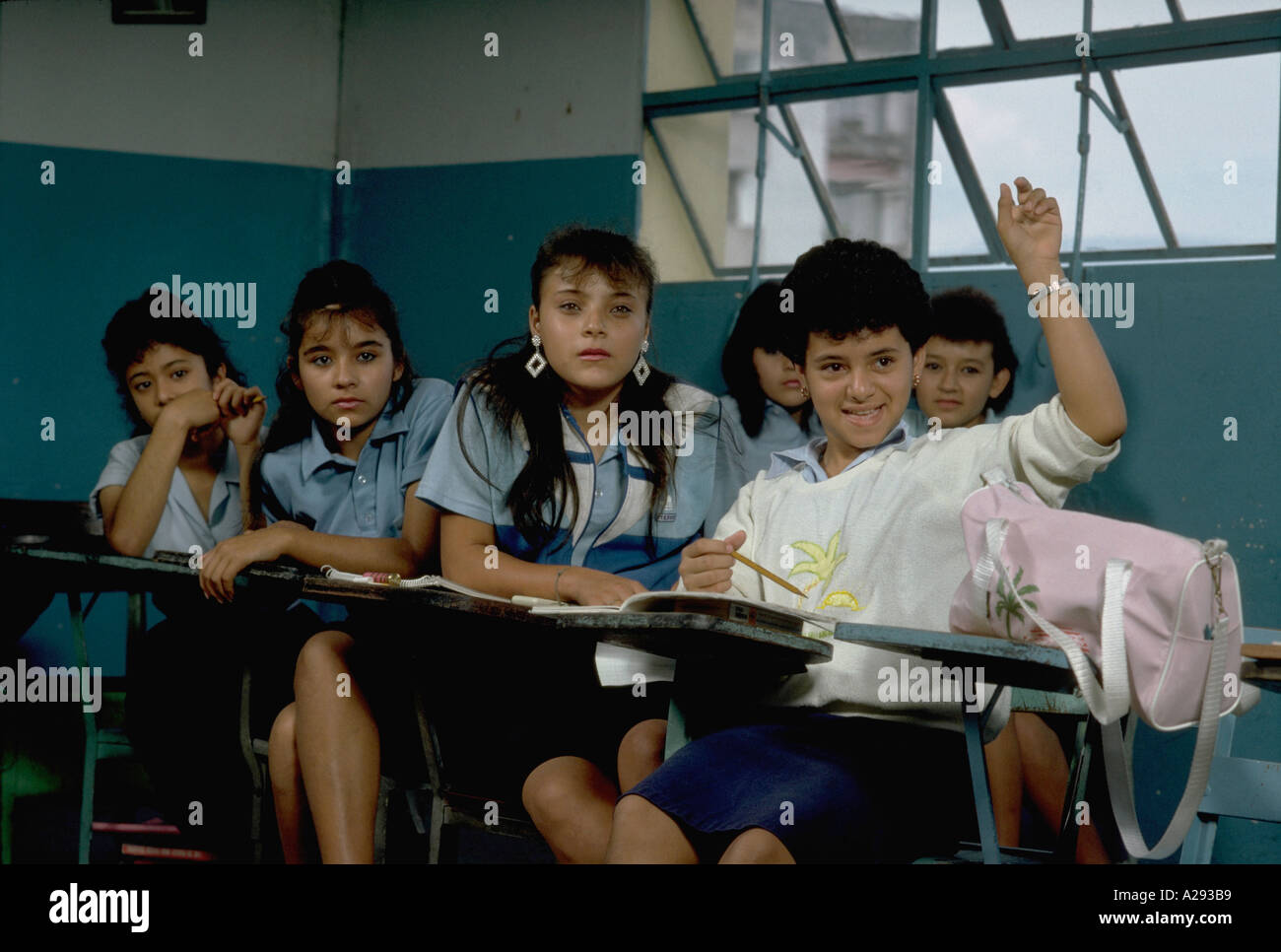 Raised hands school uniform group hi-res stock photography and images ...