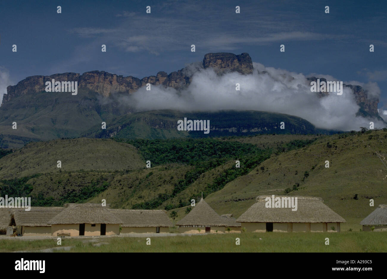 Auyan tepui mountain rises up above the Camp Kavak tourist village in ...