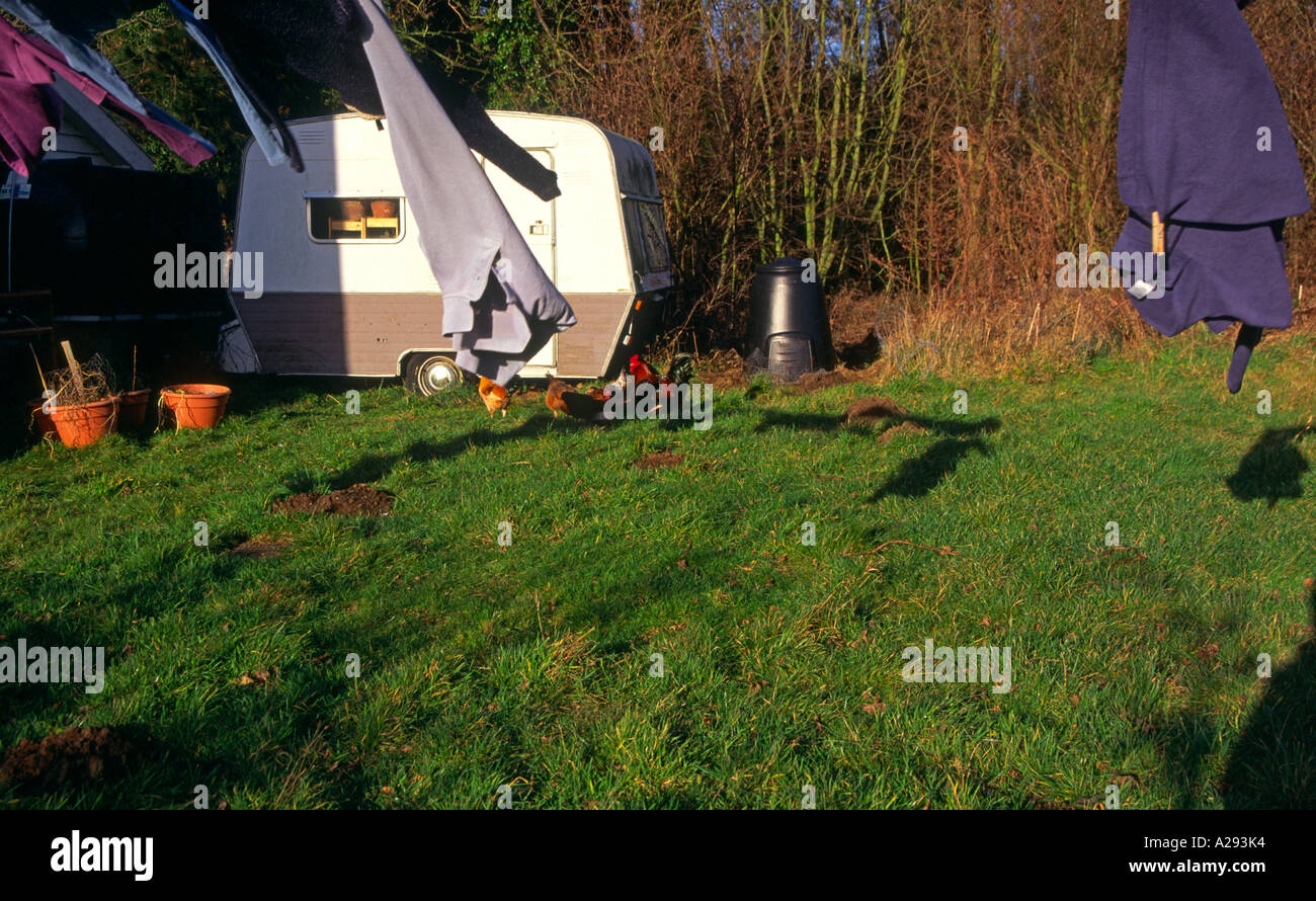 Washing line clothes and caravan in country garden Suffolk England ...