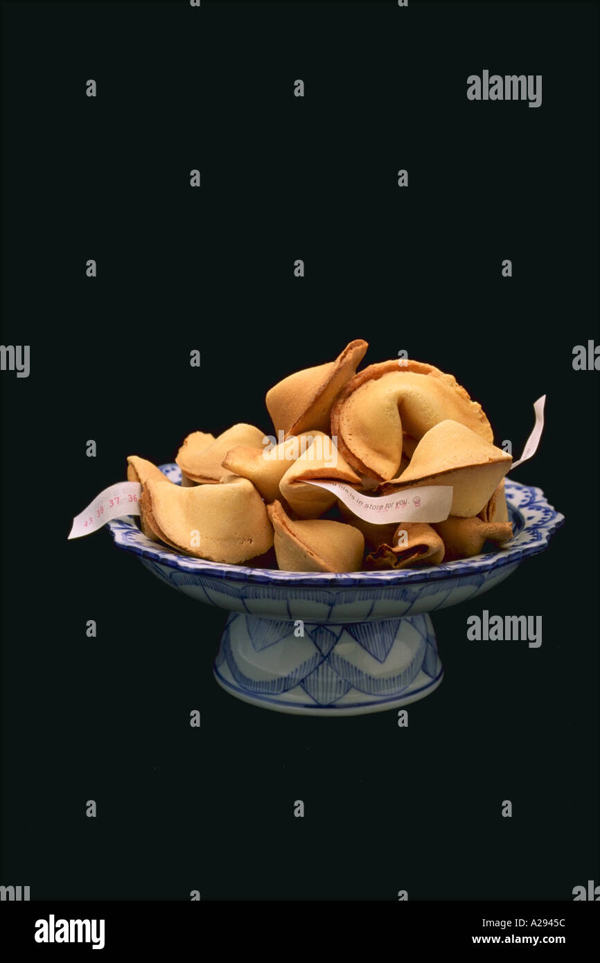 Fortune cookies in a blue and white oriental style bowl Some paper ...