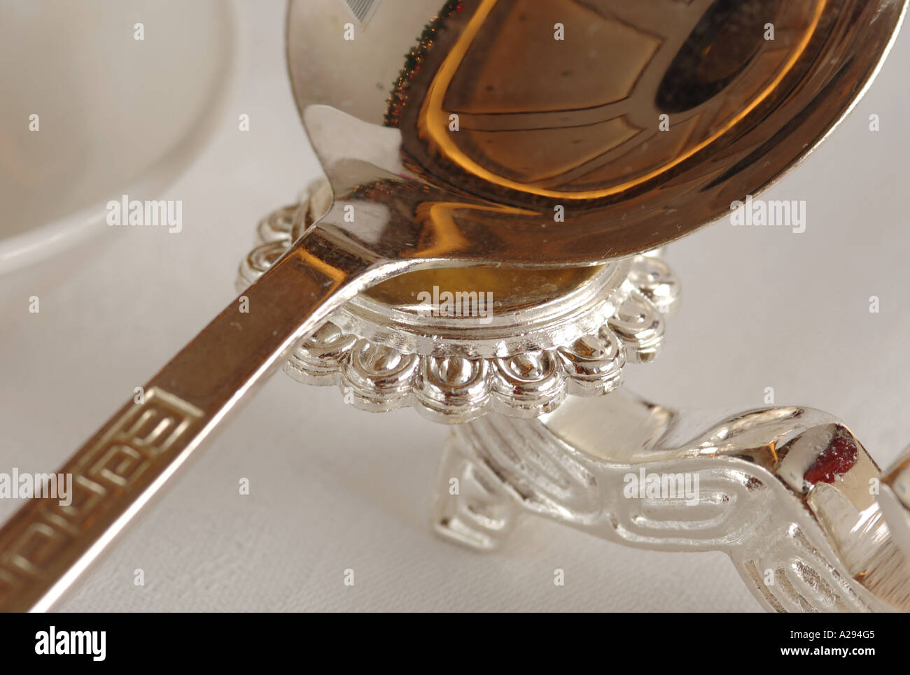 Silver spoon on top of the table Stock Photo - Alamy