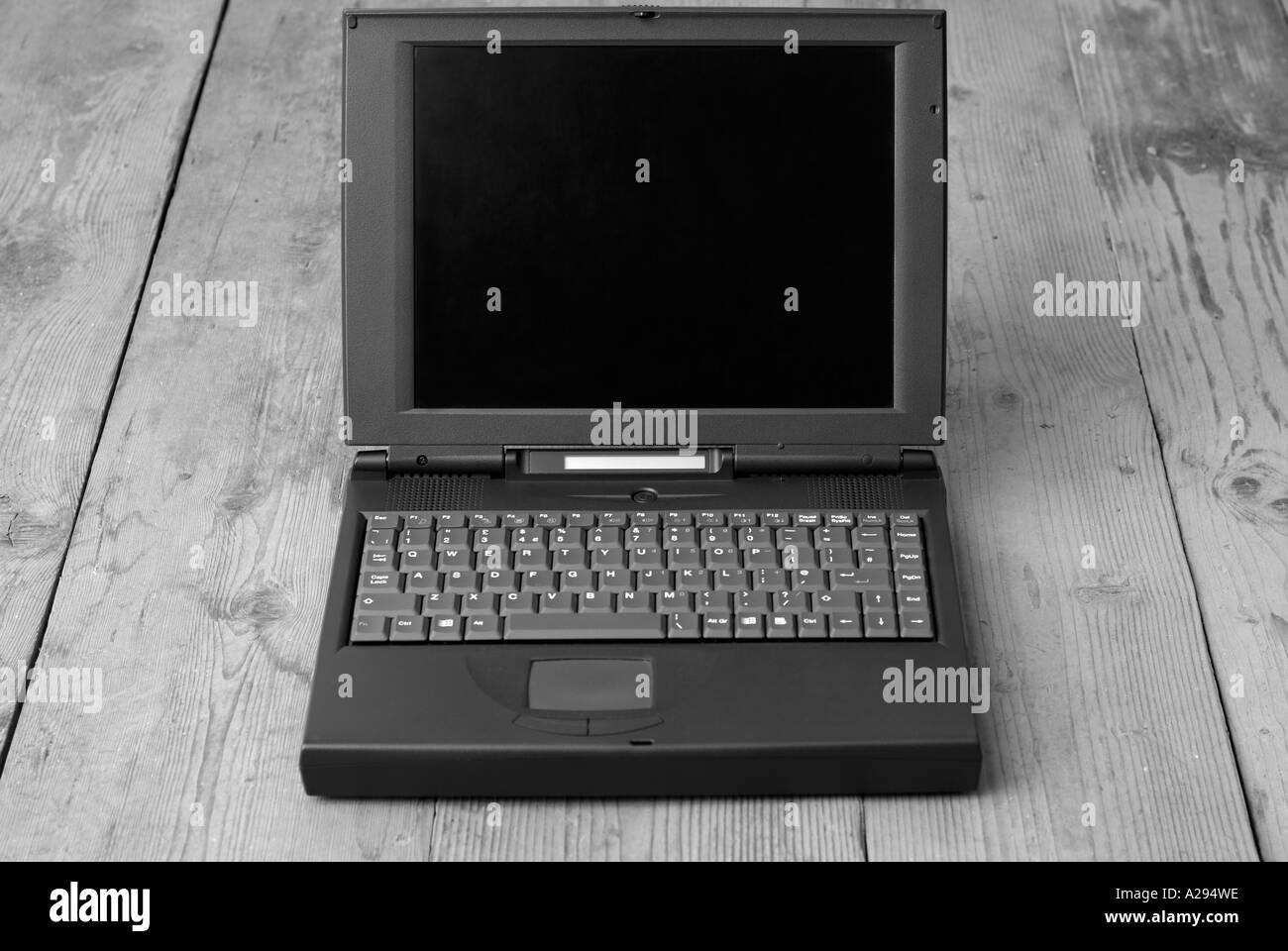 Laptop Computer on Bare Wooden Floorboards Stock Photo - Alamy