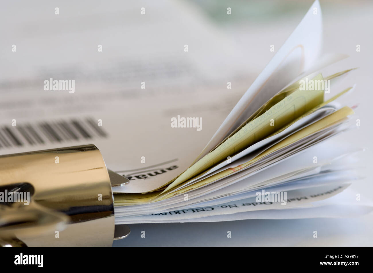 stack of invoices clamped together Stock Photo - Alamy