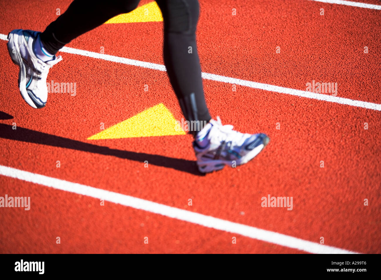 RUNNING TRACK WITH RUNNER IN MOTION Stock Photo - Alamy